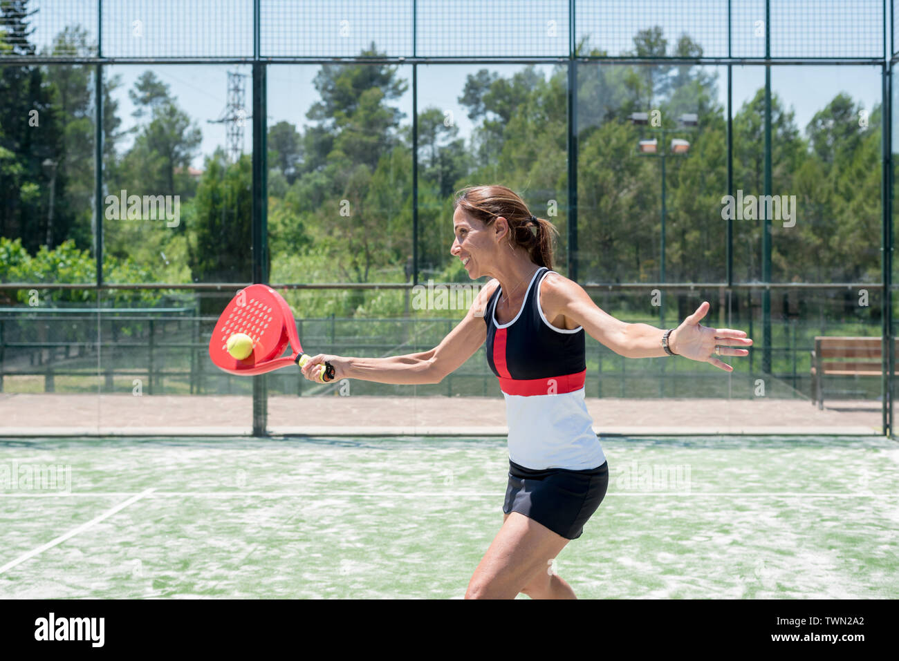 Woman playing padel outdoor Stock Photo - Alamy