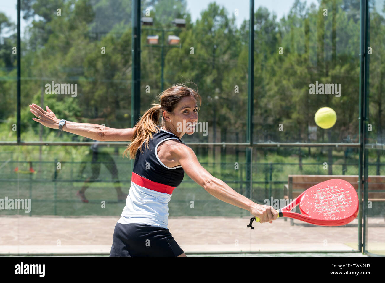 Woman playing padel outdoor Stock Photo - Alamy