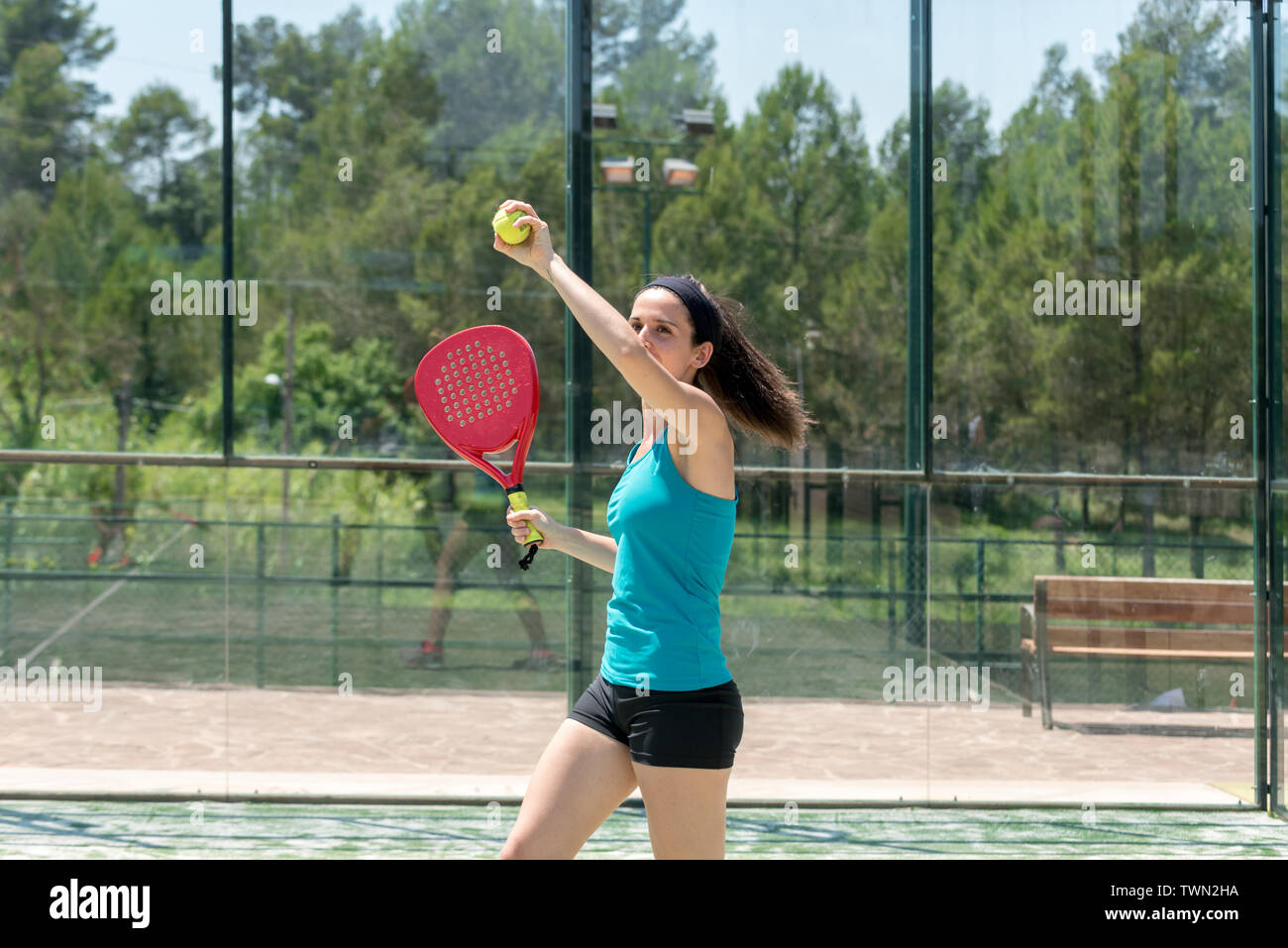 Young woman playing padel outdoor Stock Photo - Alamy