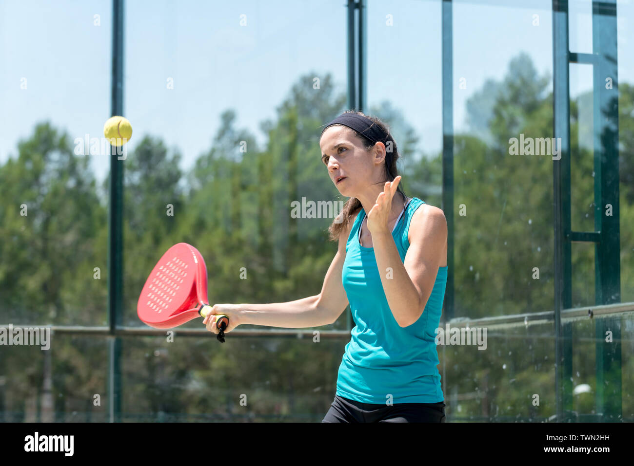 Young woman playing padel outdoor Stock Photo - Alamy