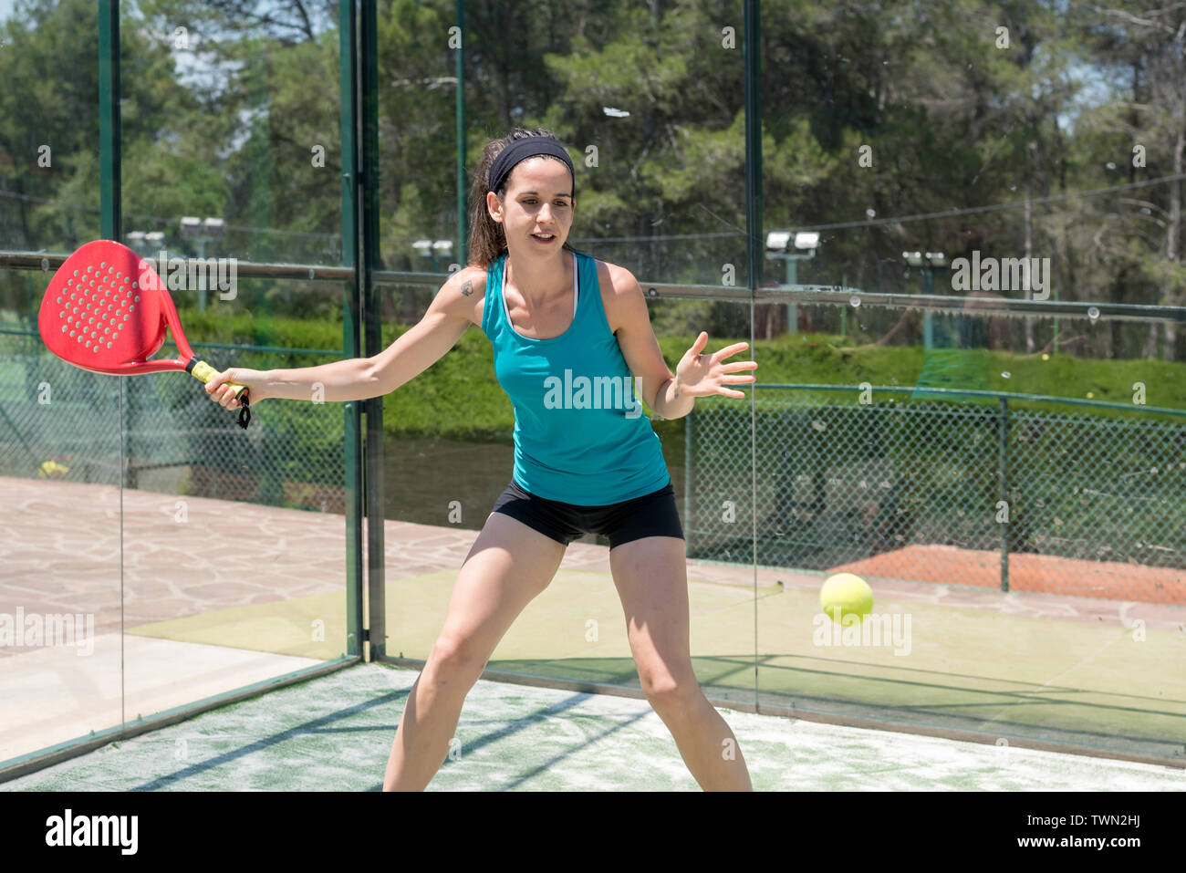 Young woman playing padel outdoor Stock Photo - Alamy