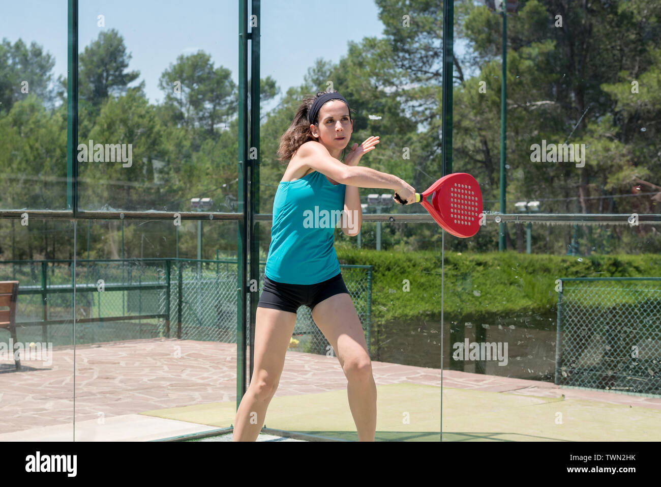 Young woman playing padel outdoor Stock Photo - Alamy