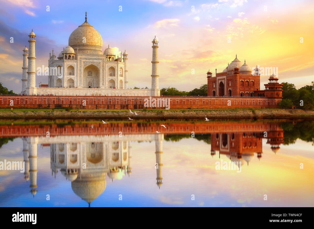 Taj Mahal at sunset with view of boat on river Yamuna at Agra India ...