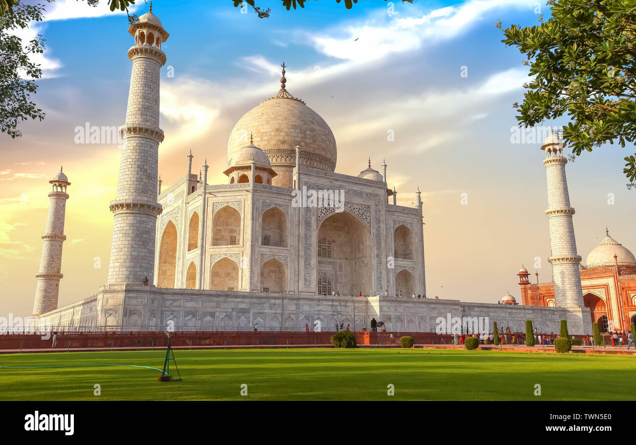 Taj Mahal historic marble mausoleum at sunset with view of tourists ...
