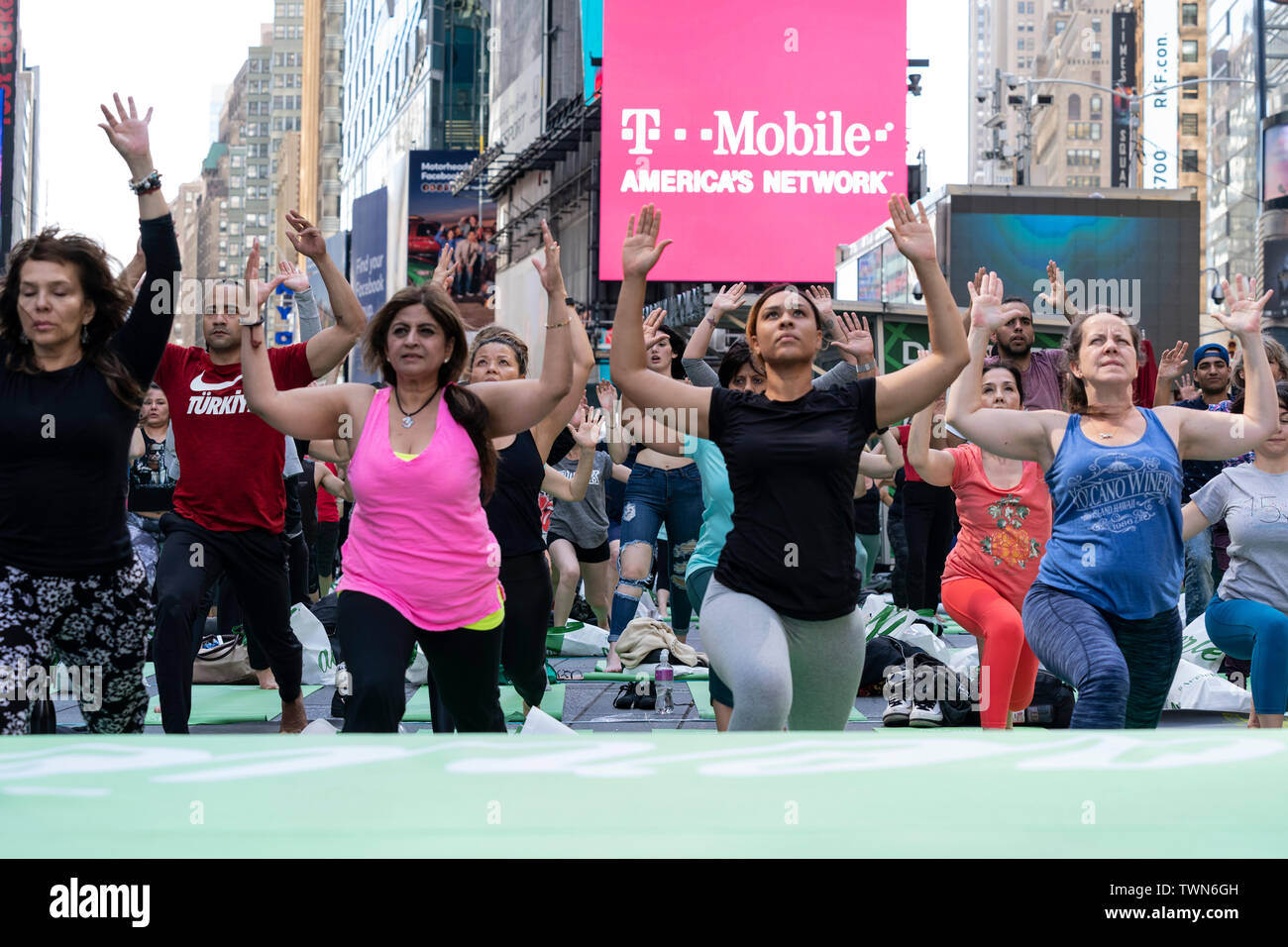 New York, NY - June 21, 2019: Hundreds yoga enthusiasts participate in ...