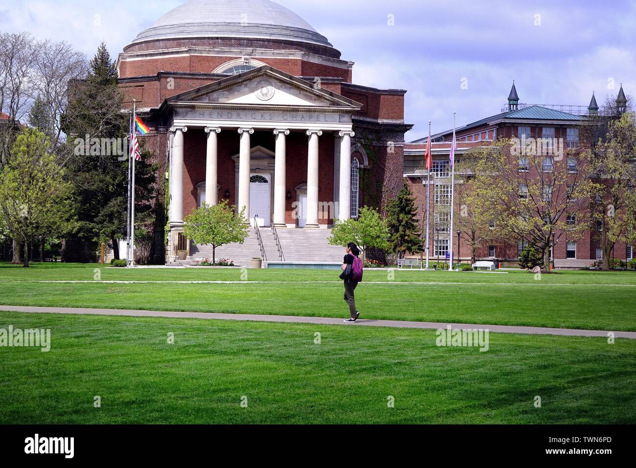 A student walks across the quad in front of Hendricks Chapel at ...
