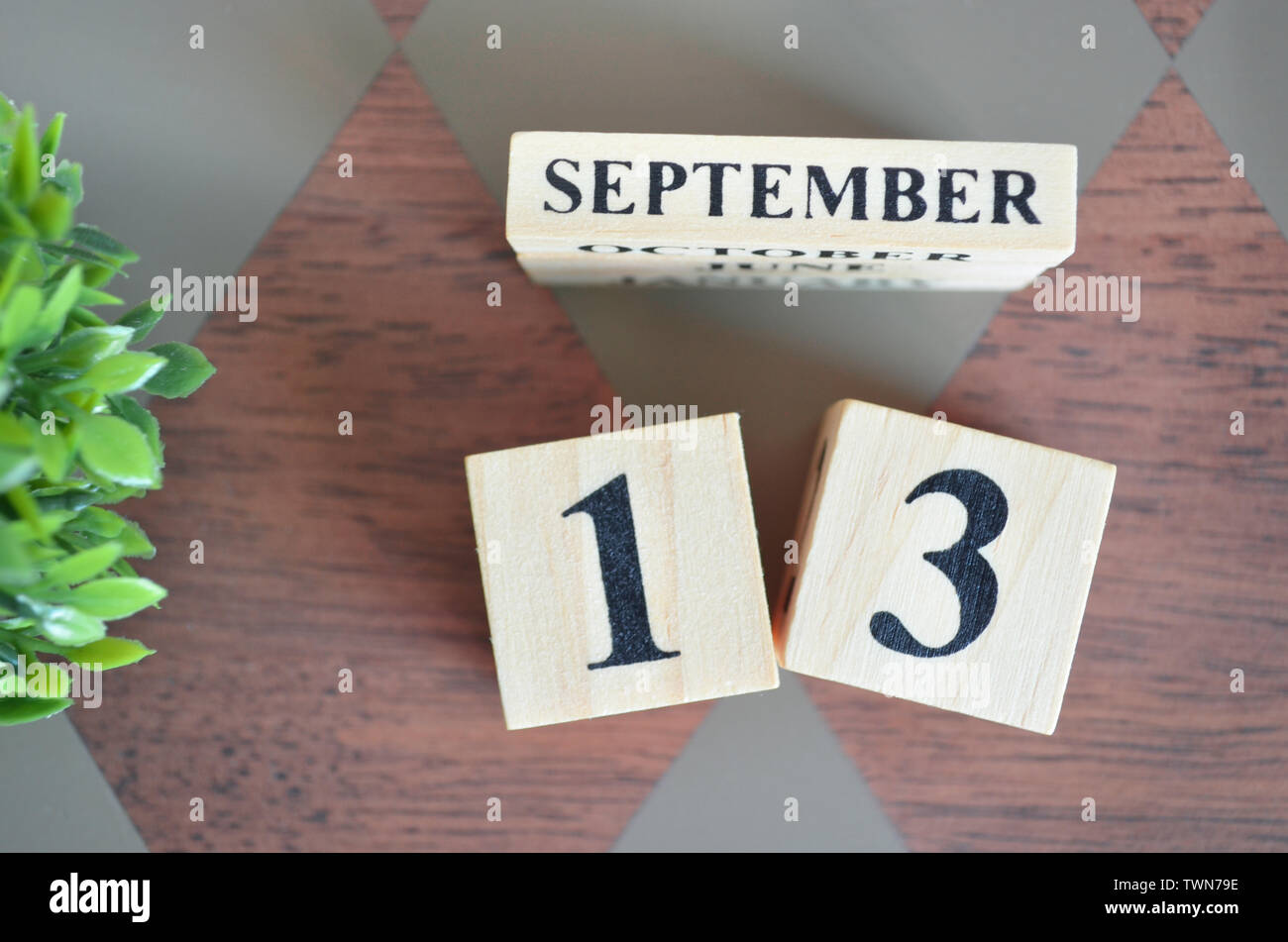 Date of September with leaf on diamond pattern table for background ...