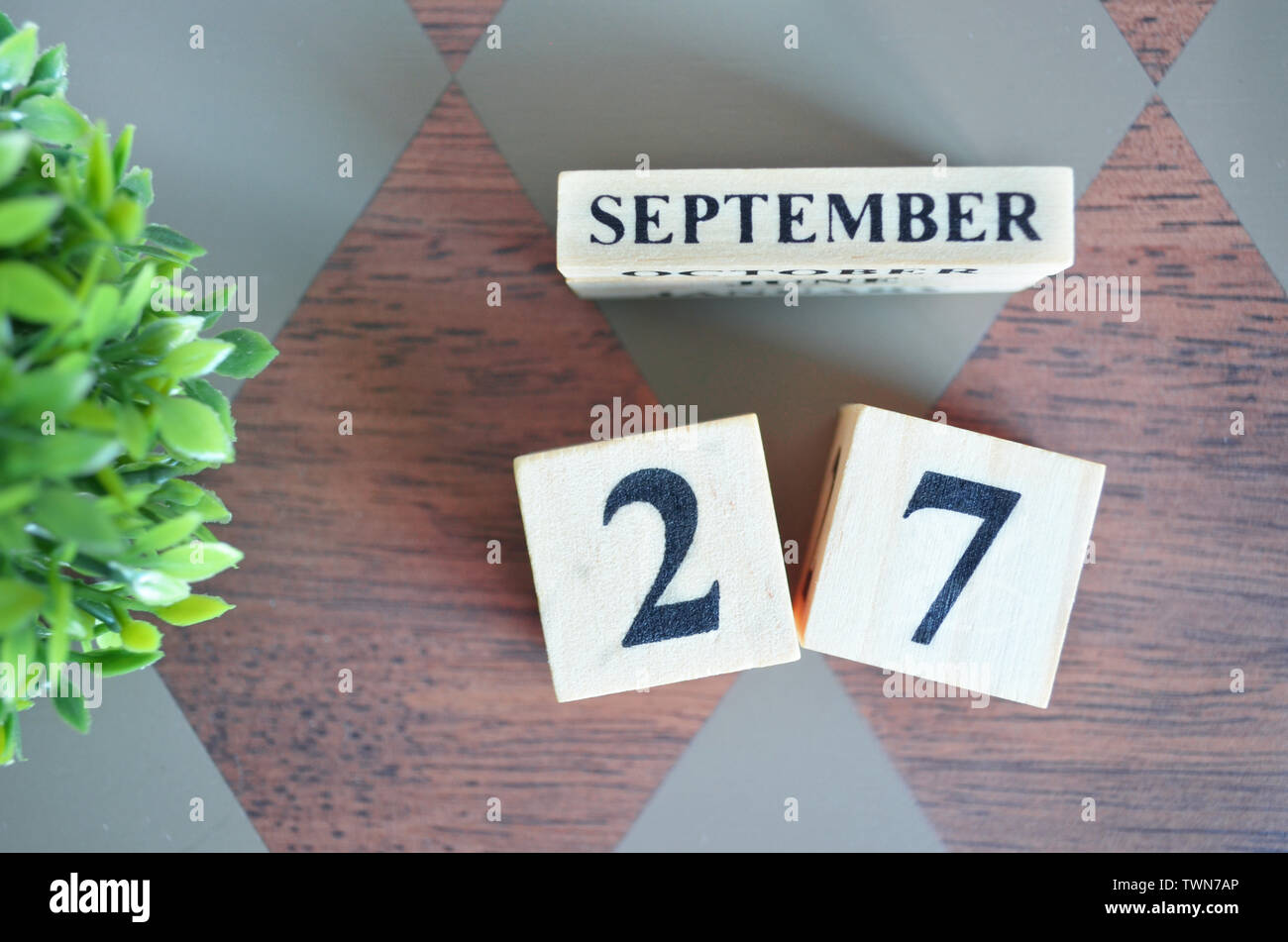Date of September with leaf on diamond pattern table for background ...