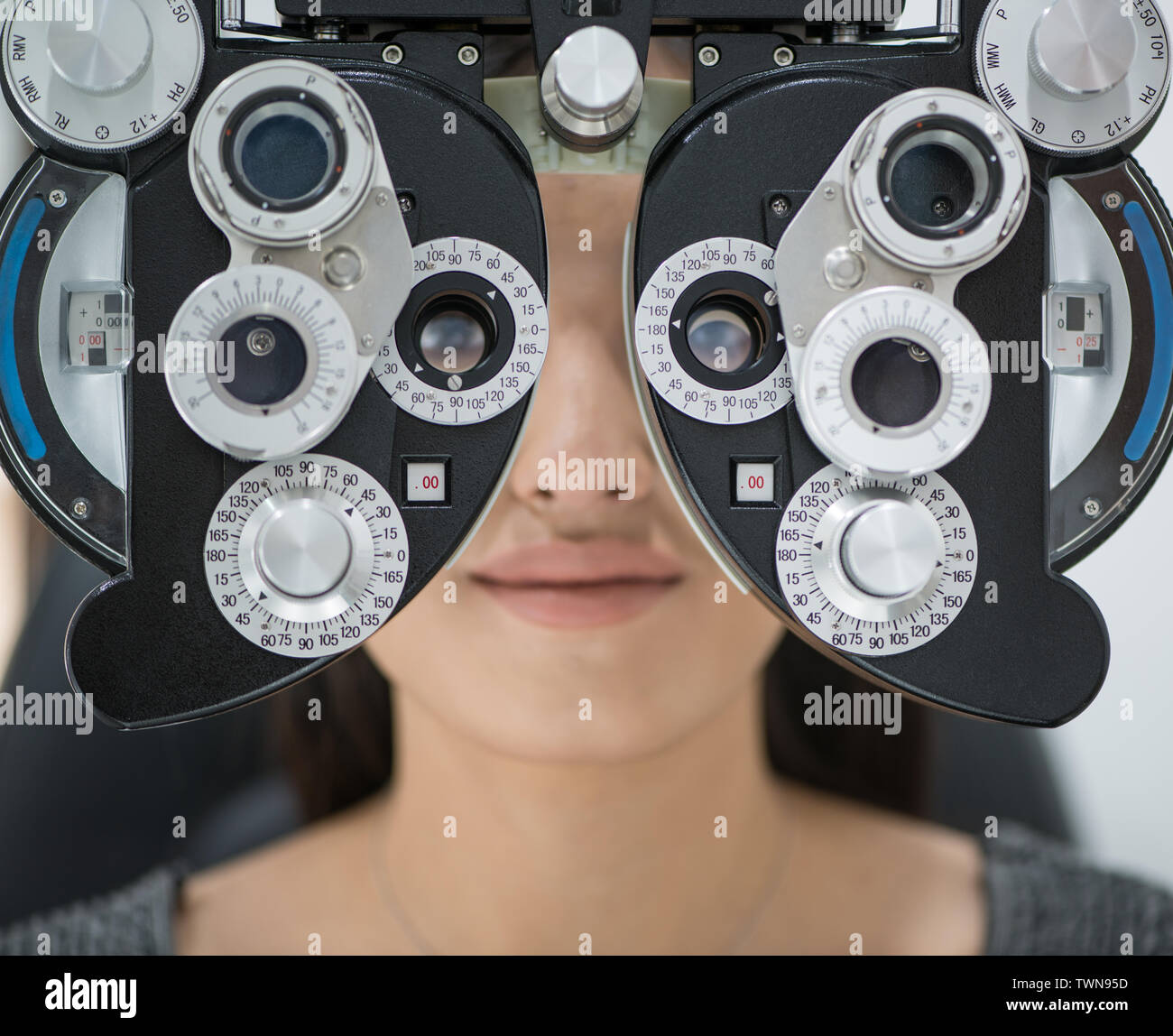 young girl patient on reception at doctor ophthalmologist. diagnostic ...