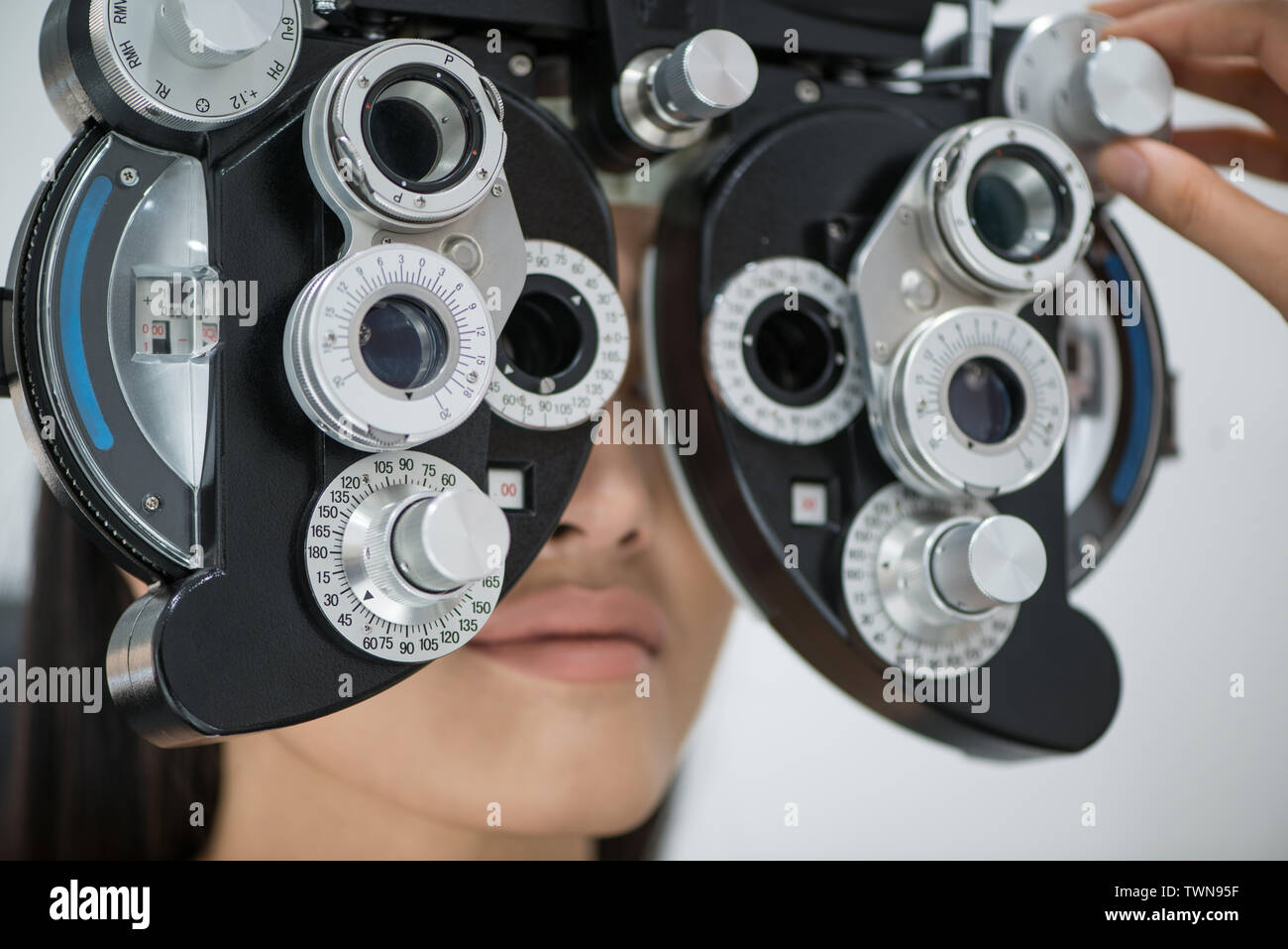 young girl patient on reception at doctor ophthalmologist. diagnostic ...
