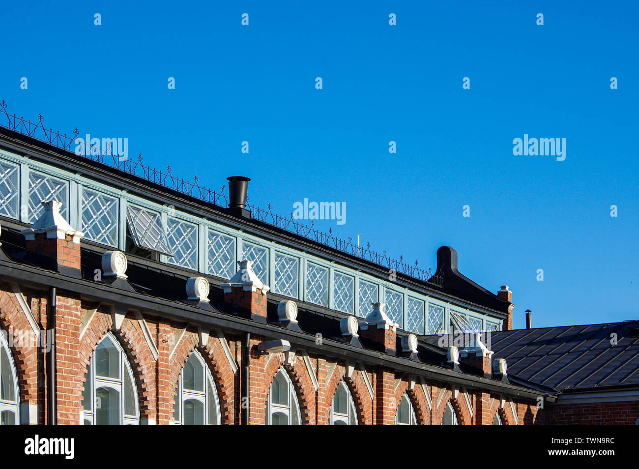 Traditional old building roof and blue sky in Oulu, Finland Stock Photo ...