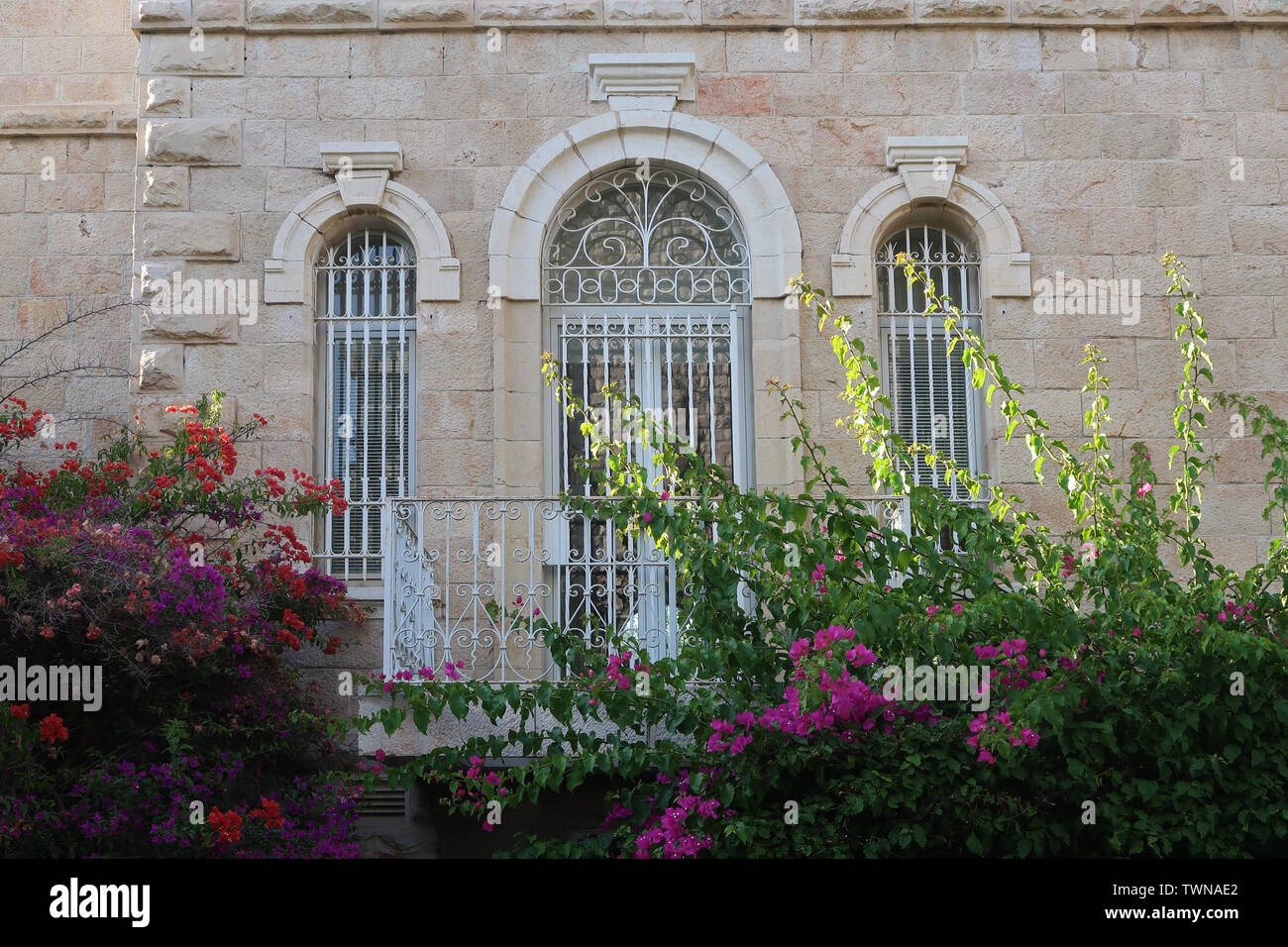 Arched windows with cast iron railings of a former Arab house built in ...