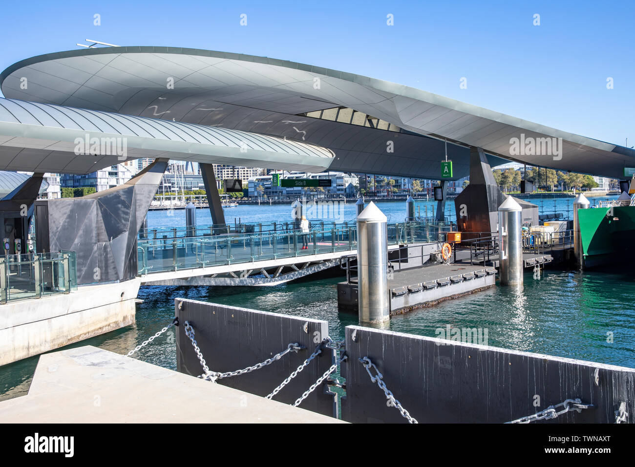 Ferry wharf and Sydney ferry at Barangaroo office development precinct ...