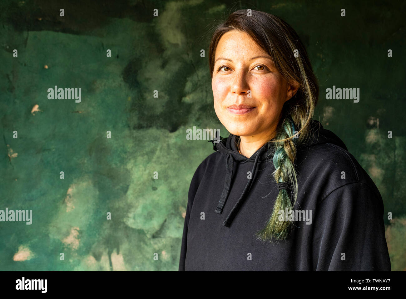 Matilda Tickner-Du. Creation of a large wall mural with a natural ...