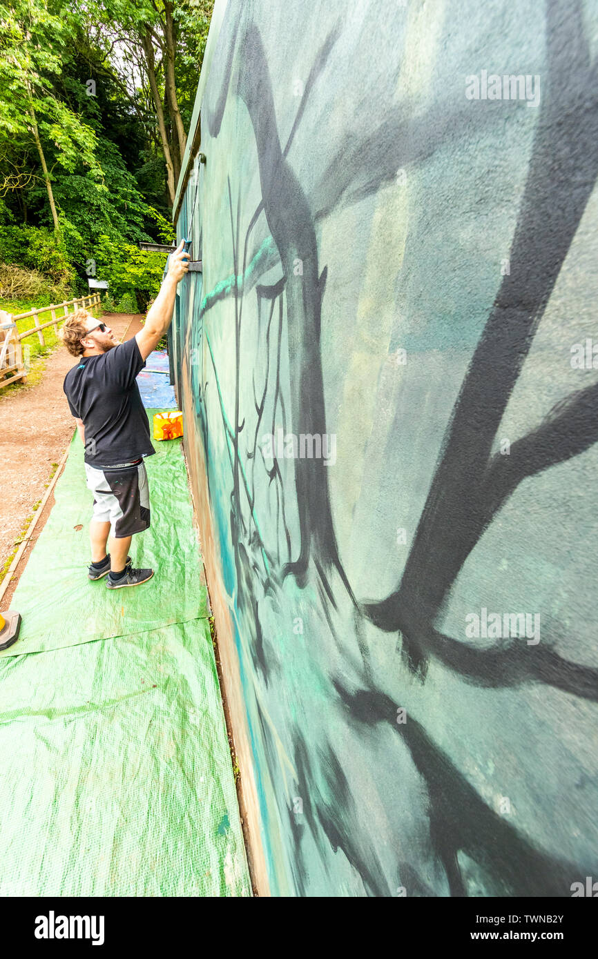 Artist Jim Vision. Creation of a large wall mural with a natural ...