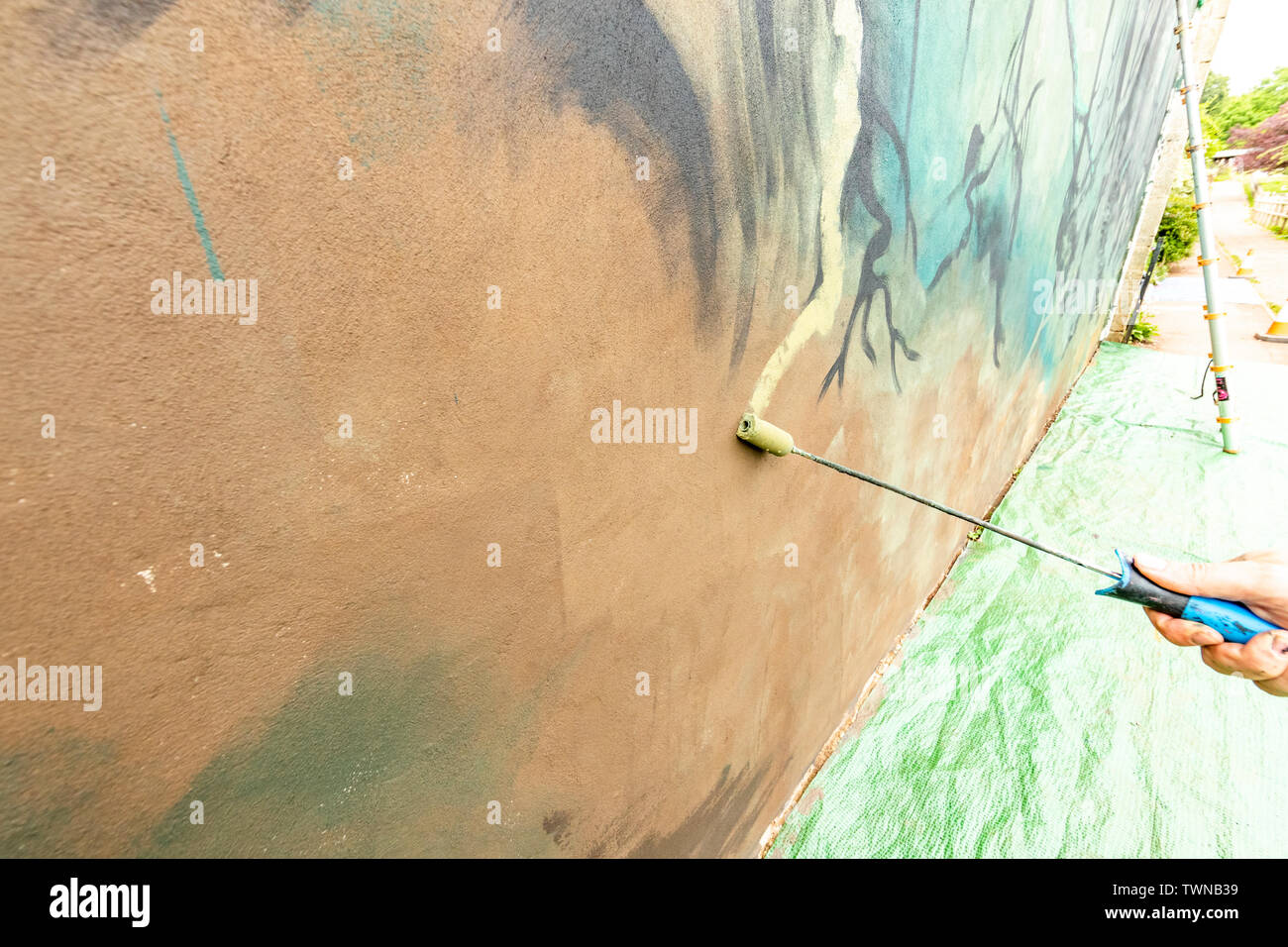 Artist Jim Vision. Creation of a large wall mural with a natural ...