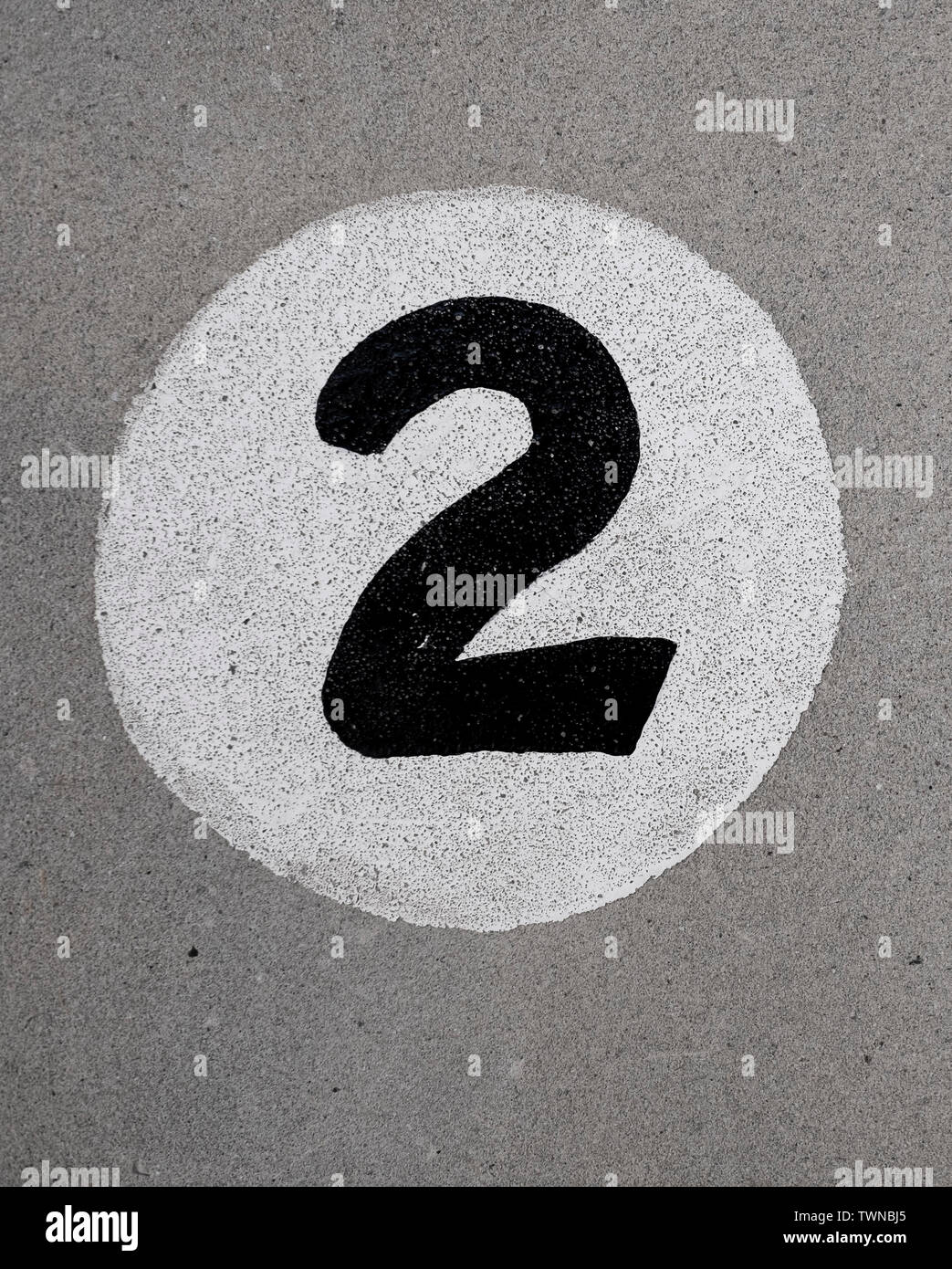 Painted number two on a rendered wall Stock Photo - Alamy