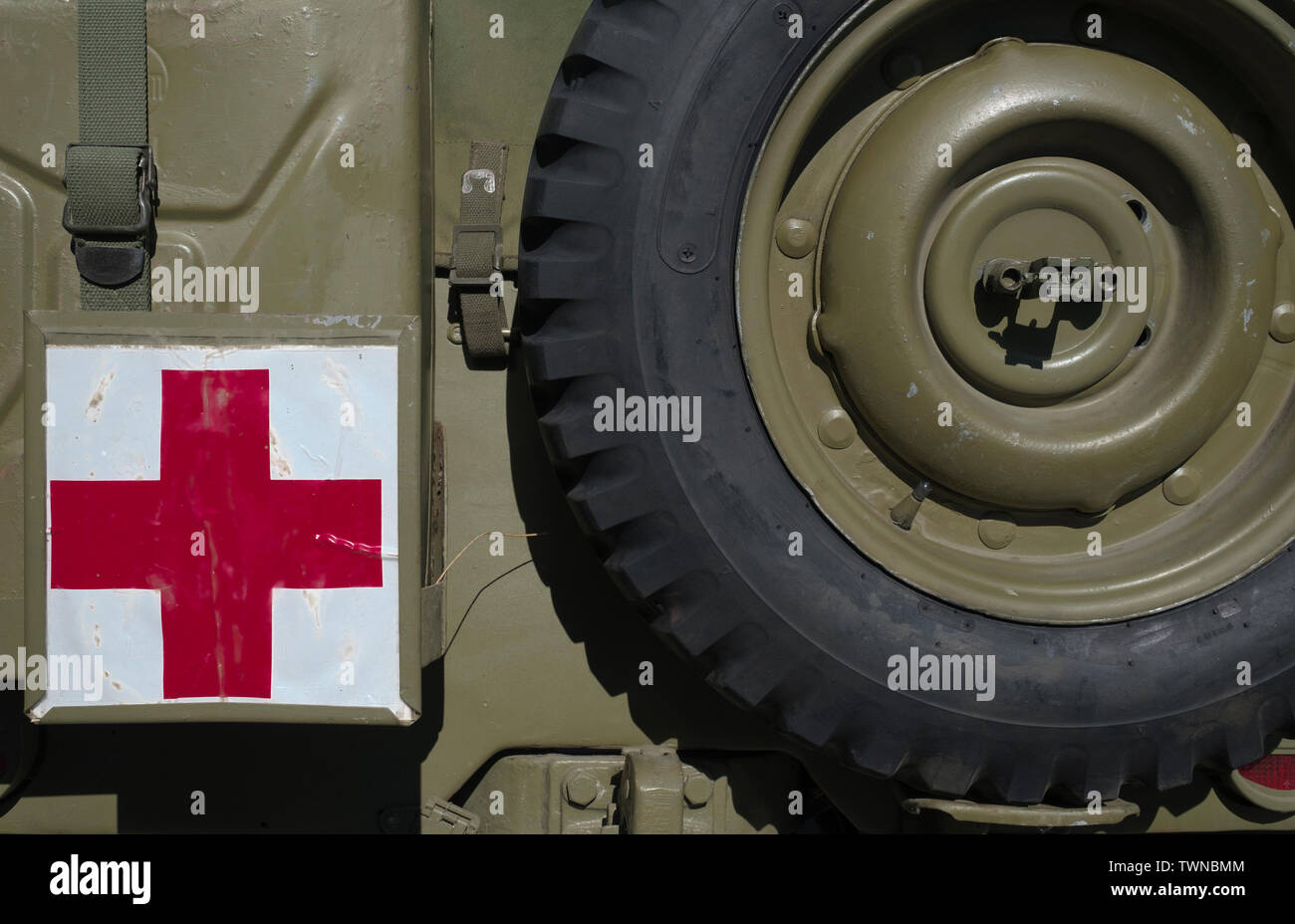 Metallic red cross symbol on the back of an old military jeep Stock ...