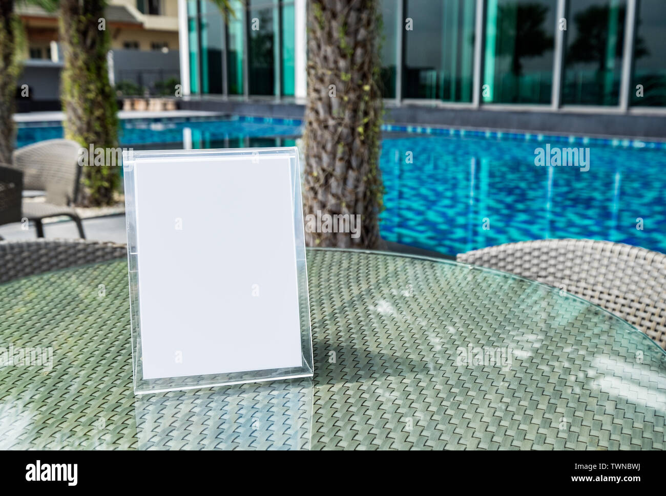 Signboard blank on glass table at side swimming pool Stock Photo - Alamy