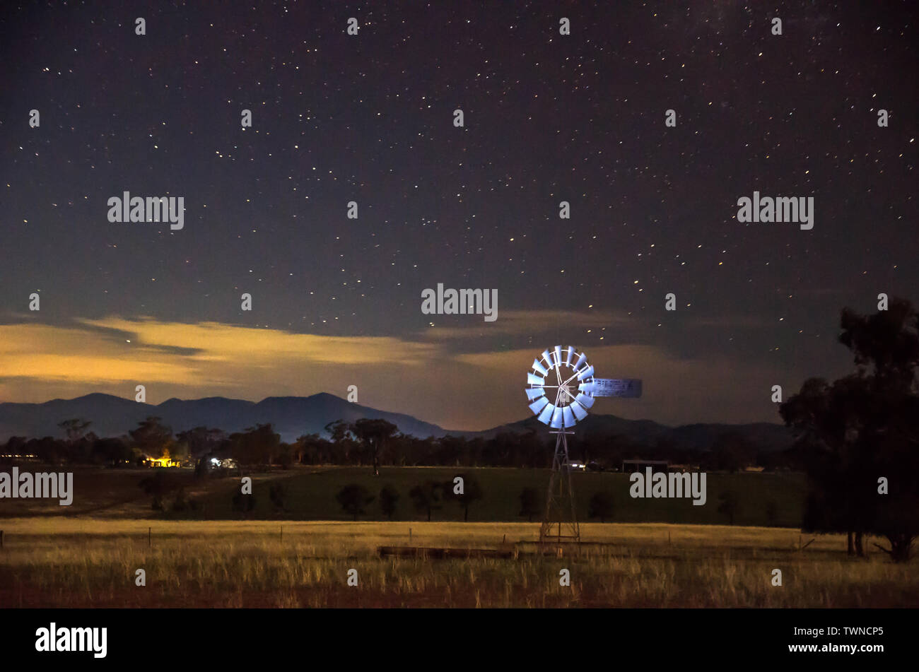 Moon lit view with stars in sky over farm land at Tamworth NSW ...