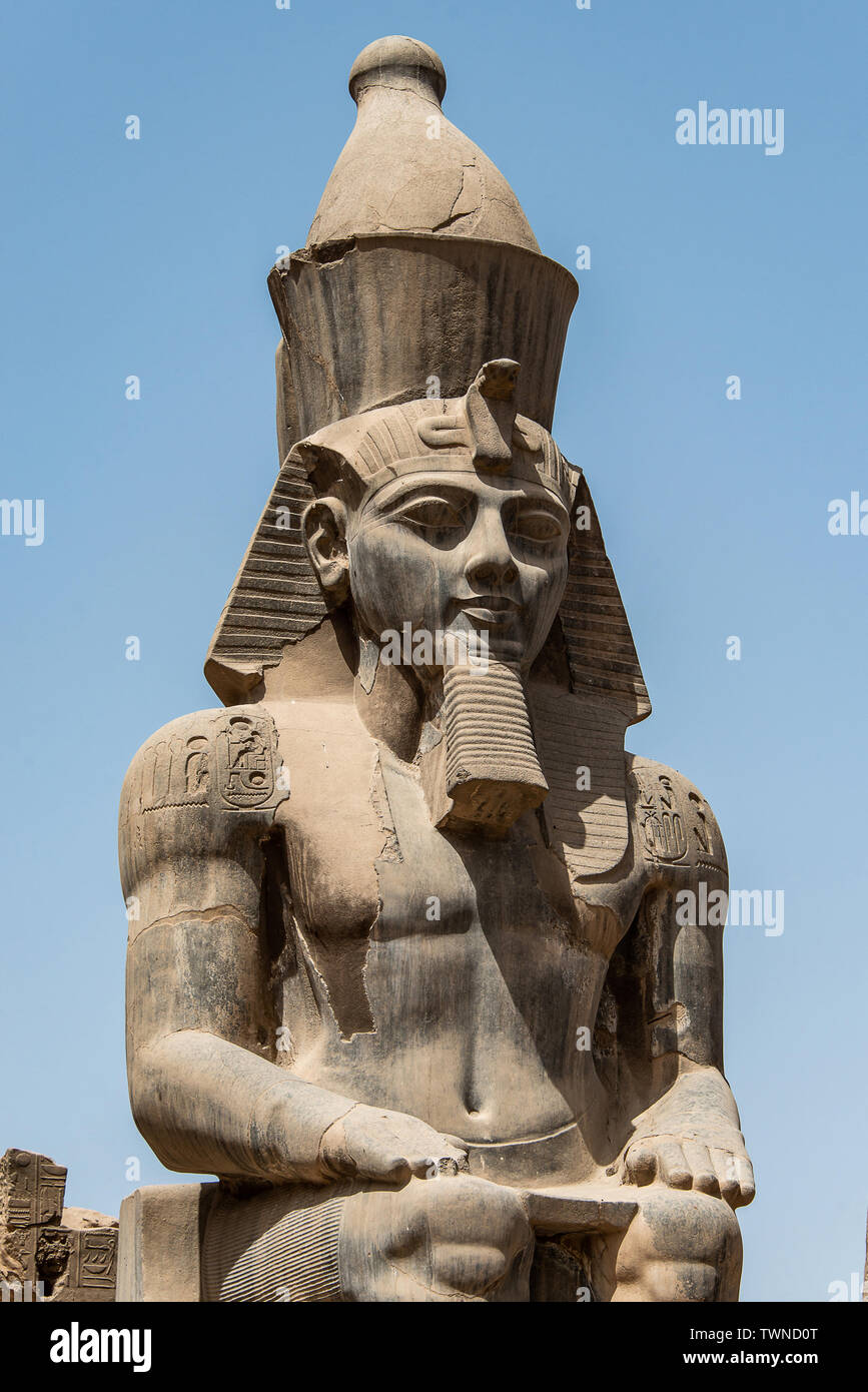 Egypt Luxor Temple. granite Statue of Ramesses II seated in front of ...