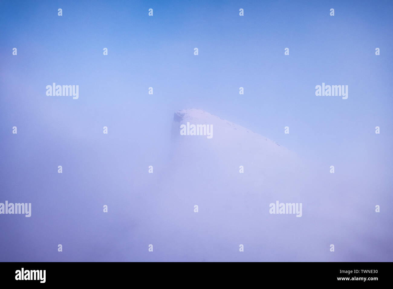 Snow mountain in blizzard on peak in morning Stock Photo - Alamy