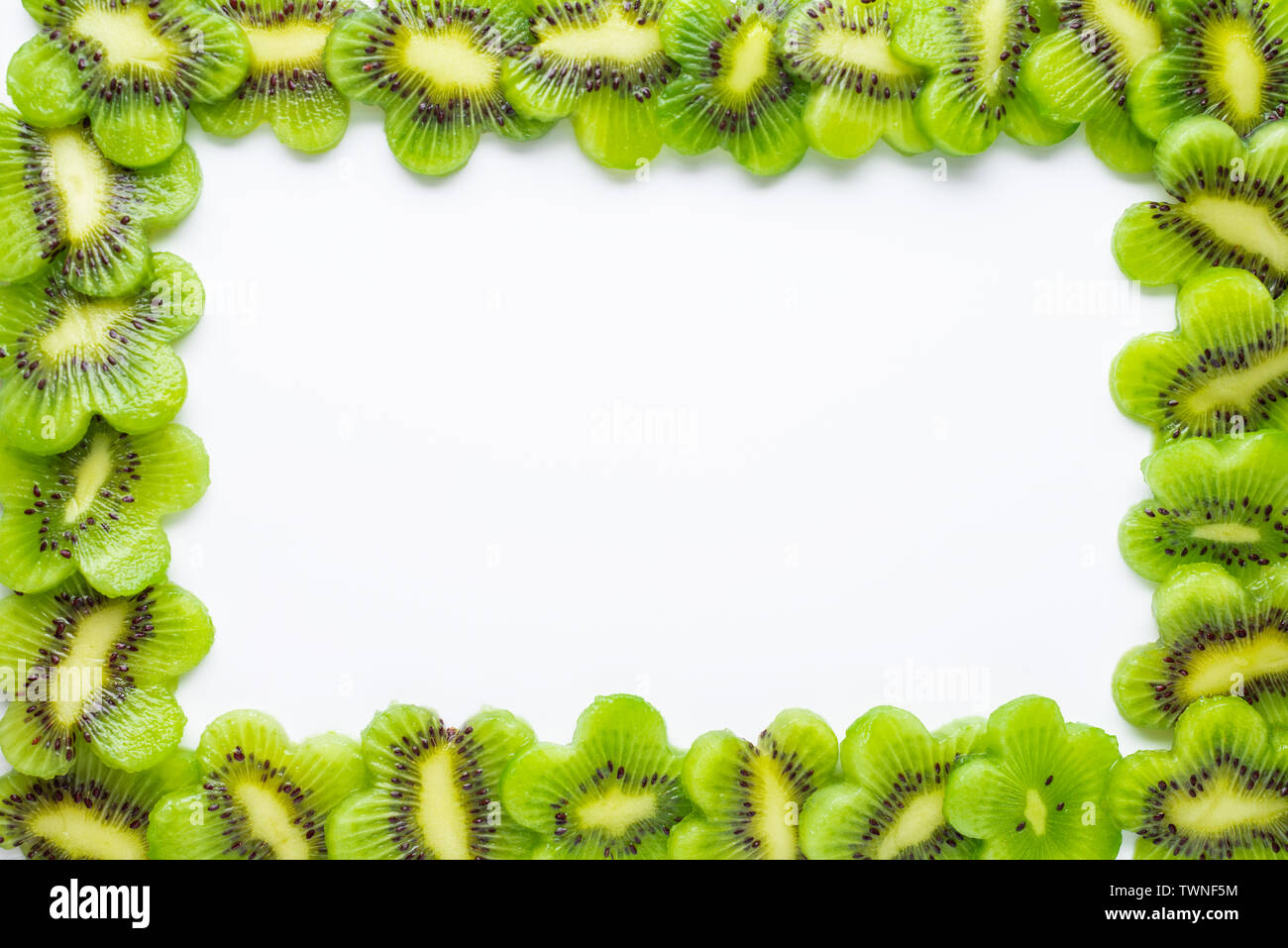 border of sliced kiwi flower shape with space for your greetings Stock ...