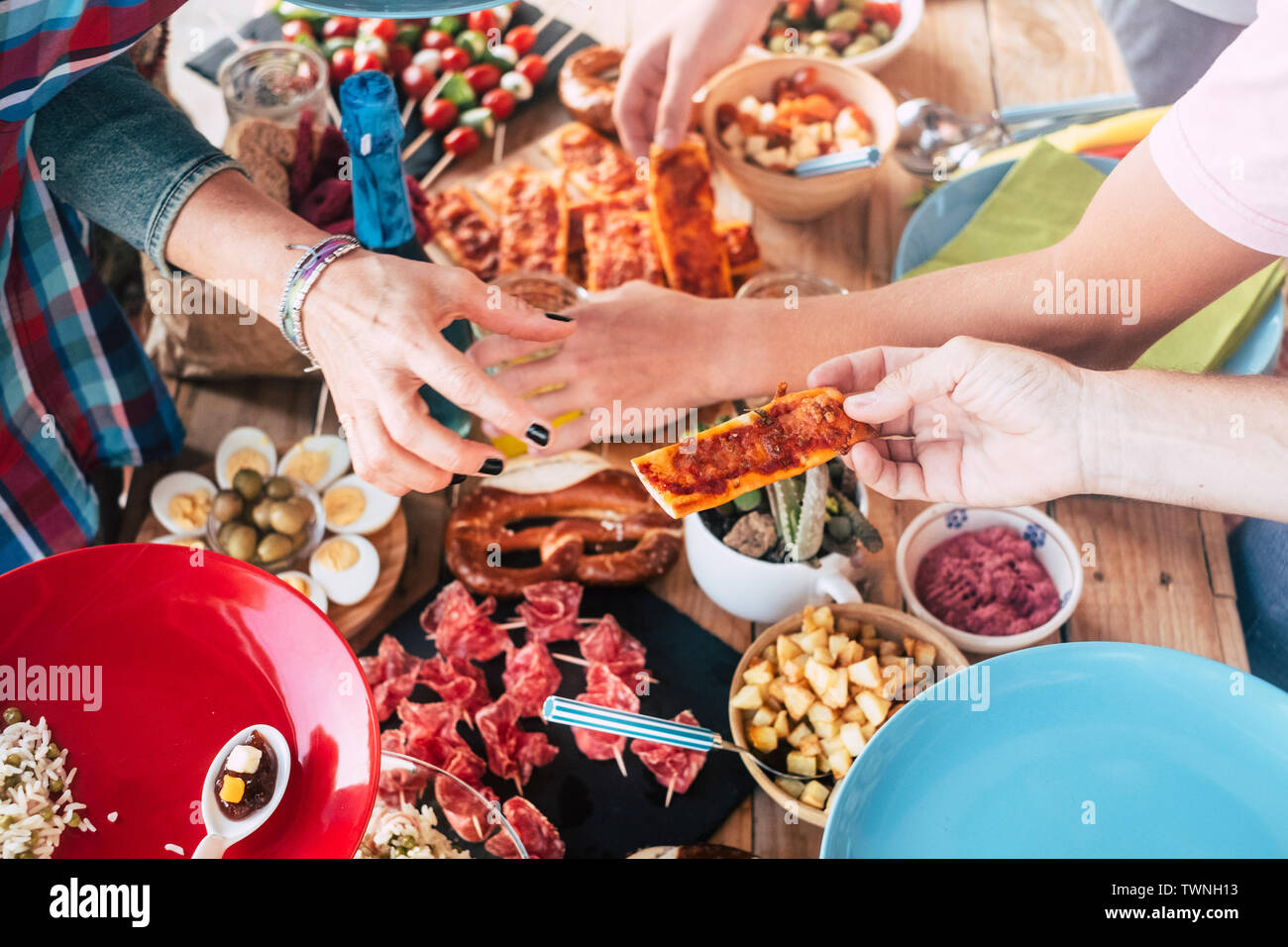 Above view of group of caucasian people eating food together - table ...