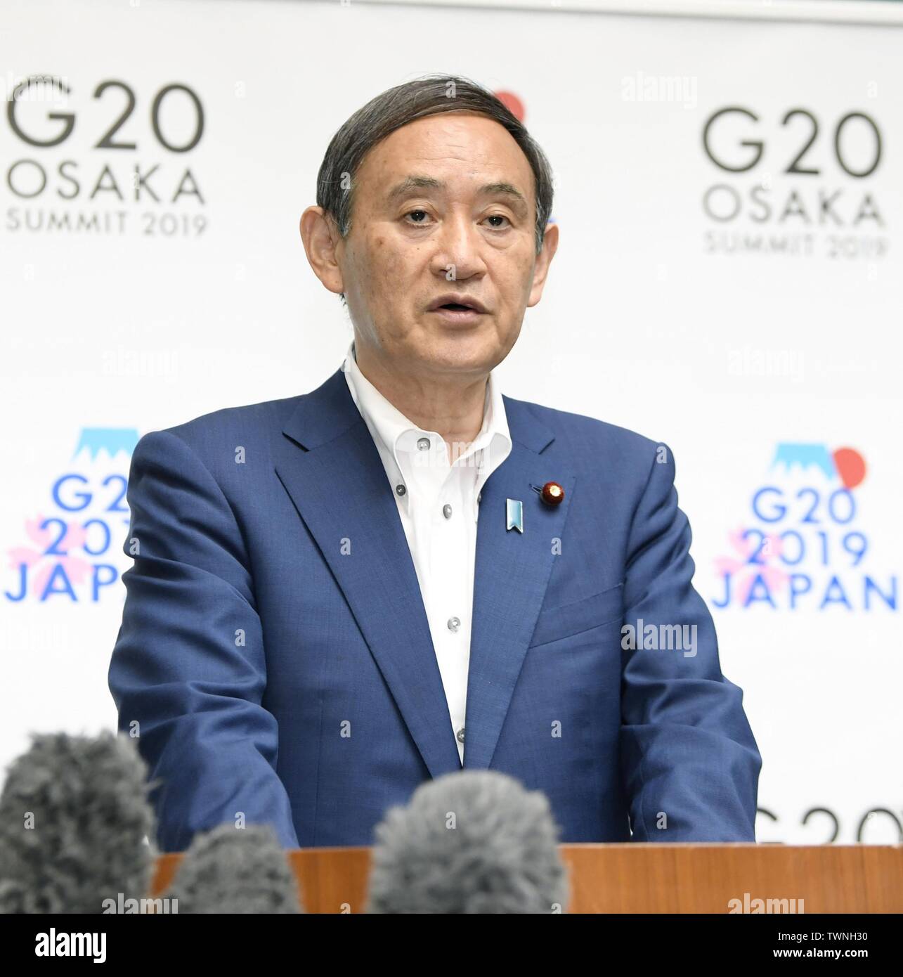 Japanese Chief Cabinet Secretary Yoshihide Suga speaks to reporters at ...