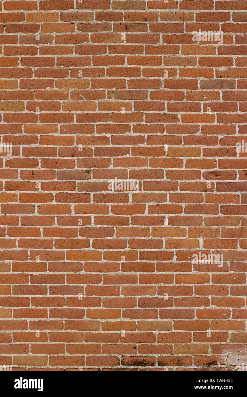 Old 19th Century weathered orange red brick wall background in ...