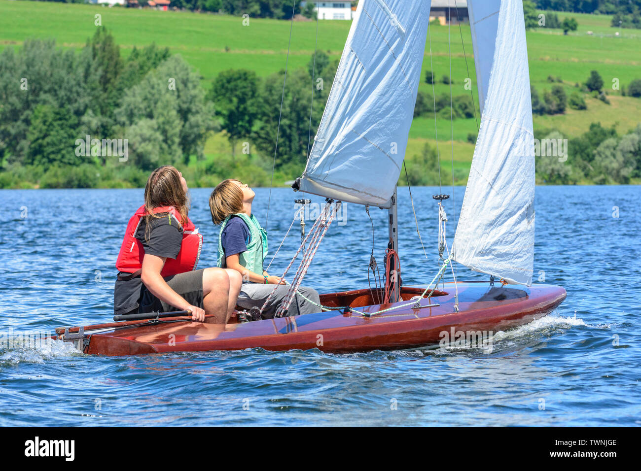 Sailing on inland lake in summertime Stock Photo - Alamy