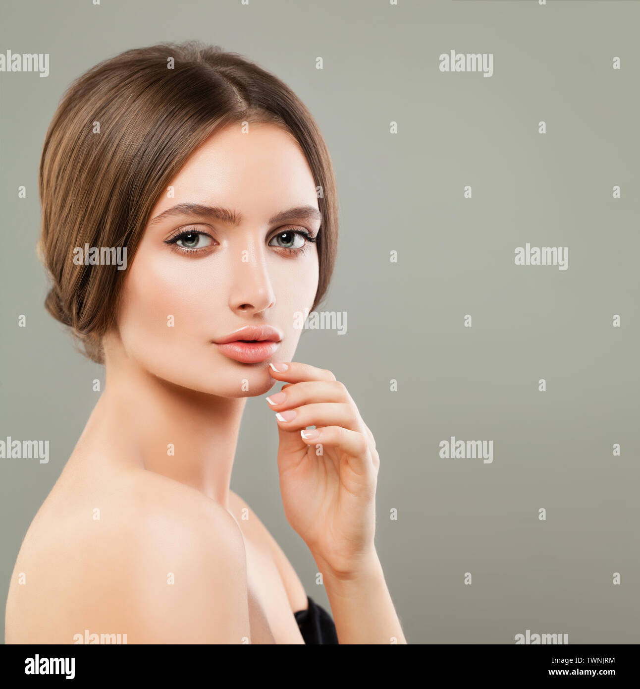 Beautiful woman with perfect skin and french nails manicure portrait ...