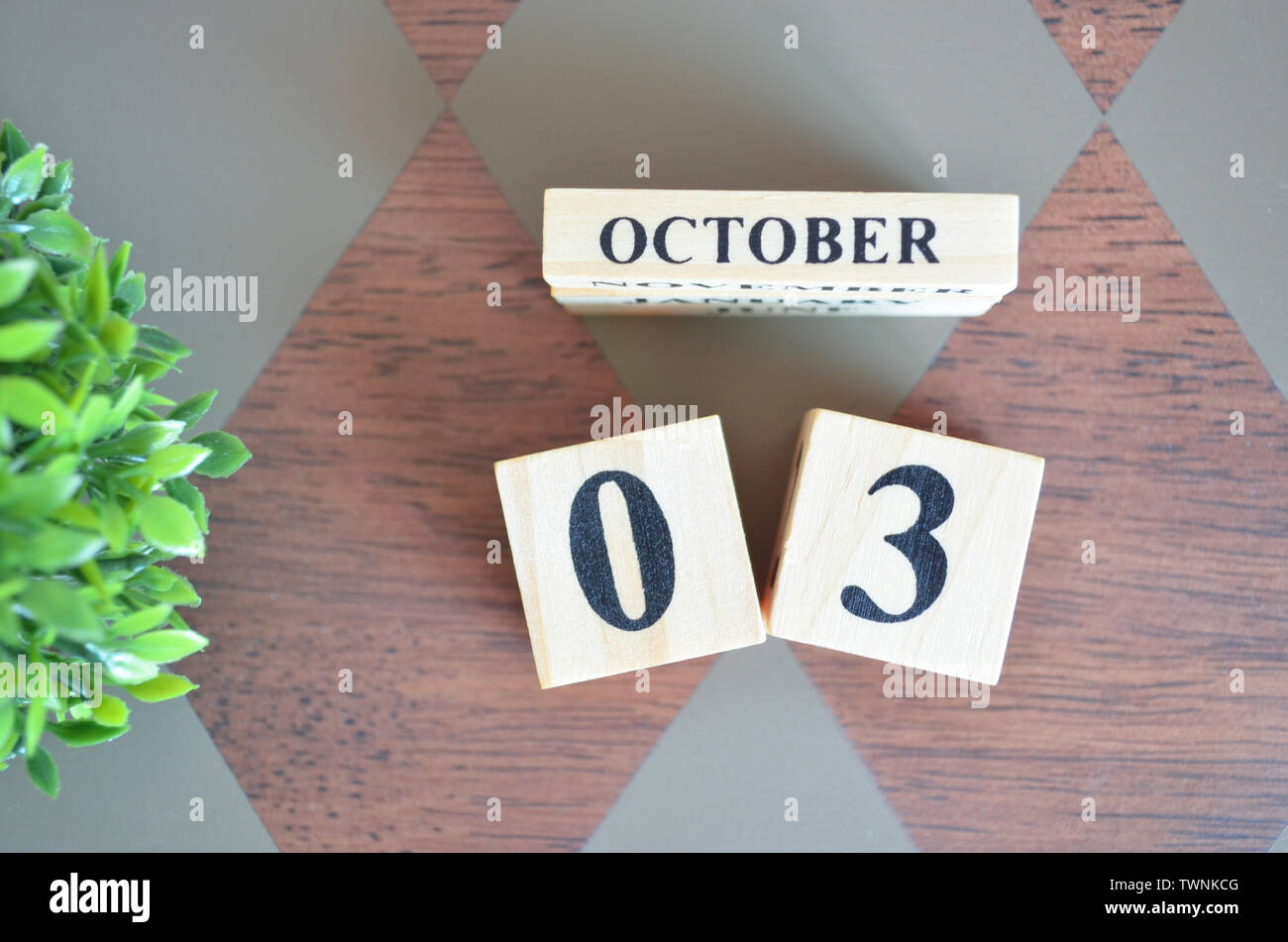 Date of October with leaf on diamond pattern table for background Stock ...