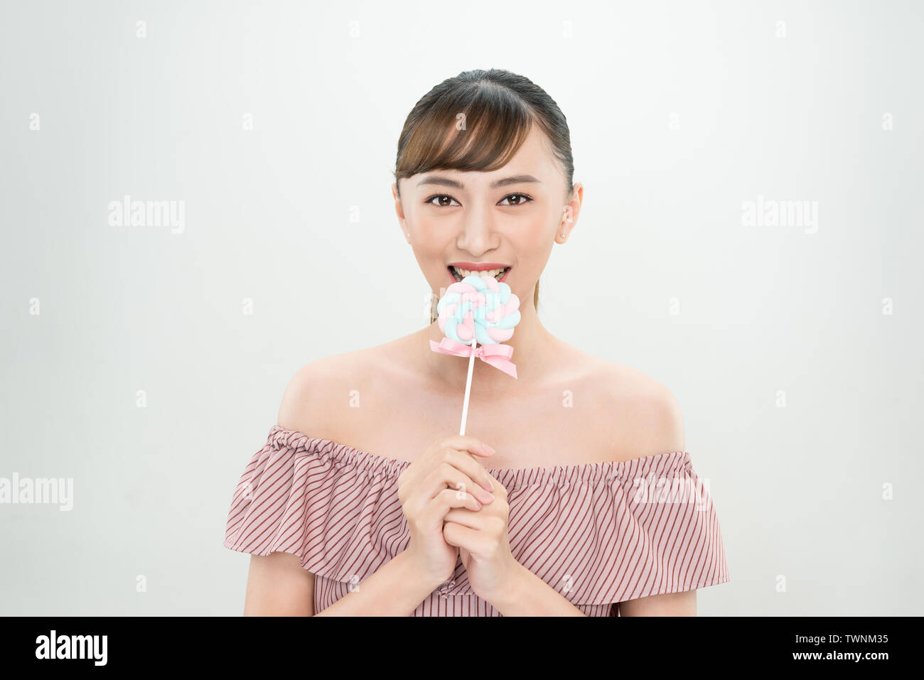 portrait Young woman with candy on white background Stock Photo - Alamy