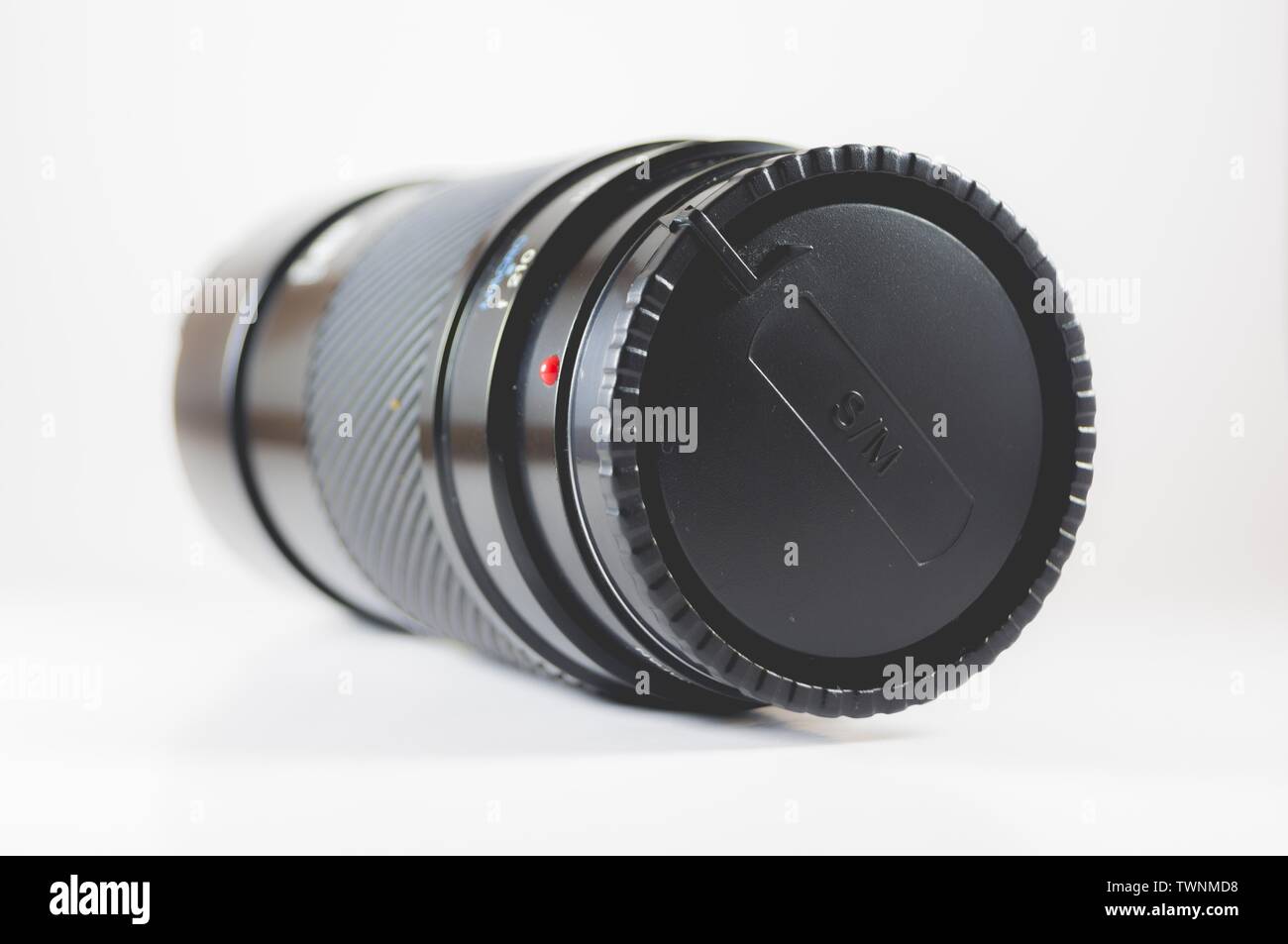 Isolated closed camera lens on a white surface with a white background ...