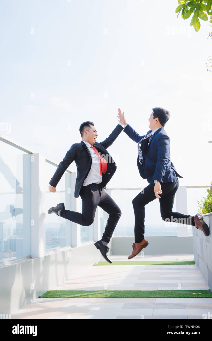 Happy high jump businessman hi-res stock photography and images - Alamy