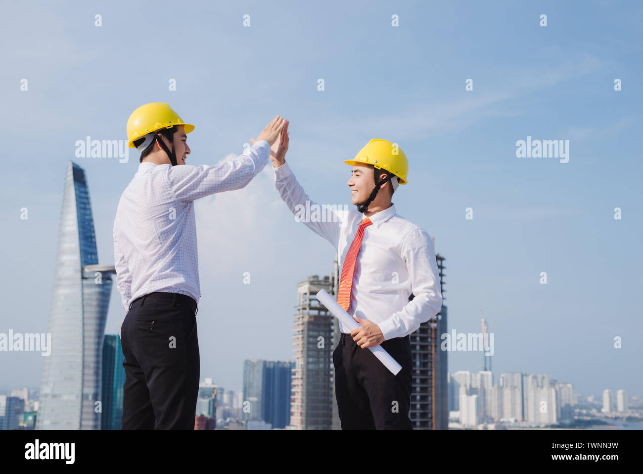 Engineer hands up in construction site Stock Photo - Alamy