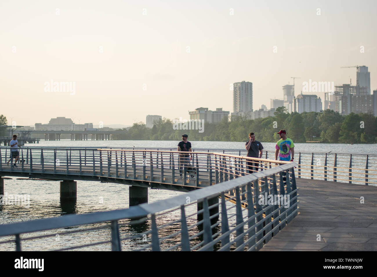 walkers on walkway in downtown austin texas Stock Photo - Alamy