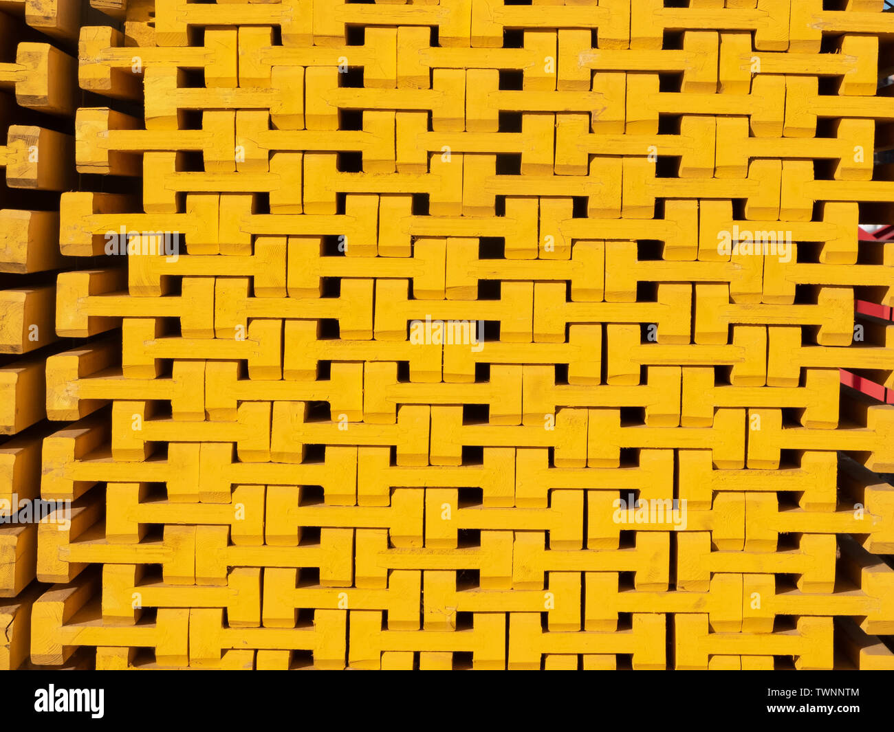 Yellow wooden piled formwork beams. Construction equipment Stock Photo ...