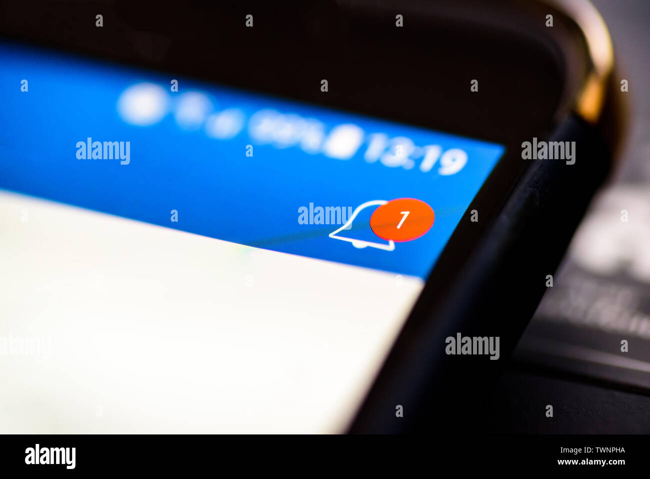 Notification bell button on smartphone app screen closeup Stock Photo ...