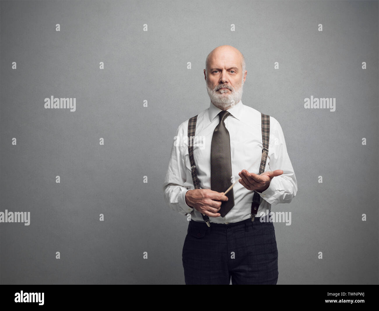 Confident serious academic professor posing and holding a stick Stock ...