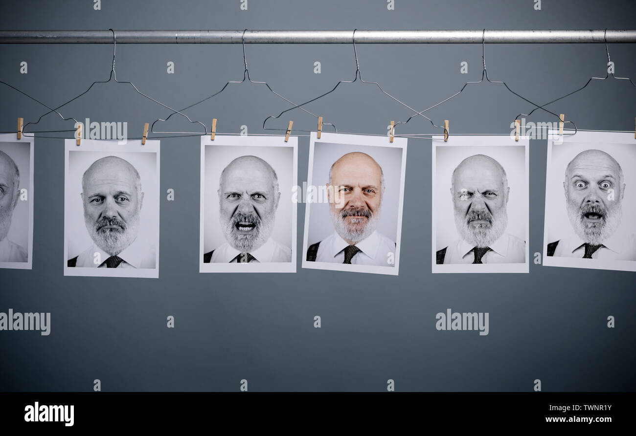 Collection of man's portraits with different facial expressions hanging ...