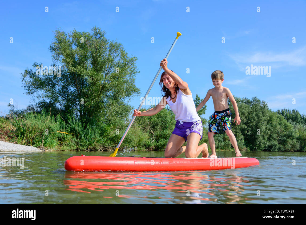 Funny times on SUP-board Stock Photo - Alamy