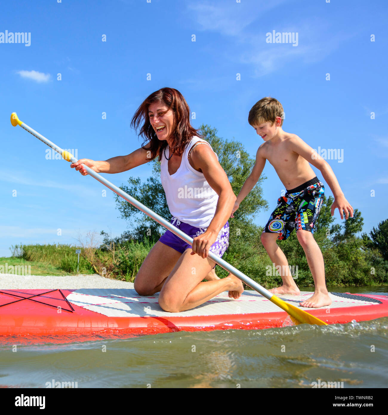 Funny times on SUP-board Stock Photo - Alamy