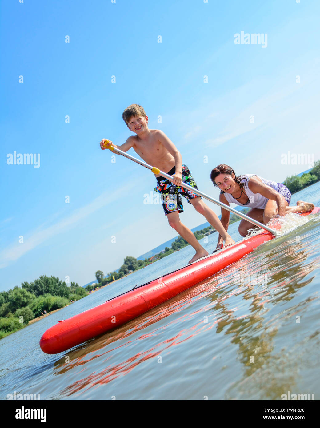 Funny times on SUP-board Stock Photo - Alamy