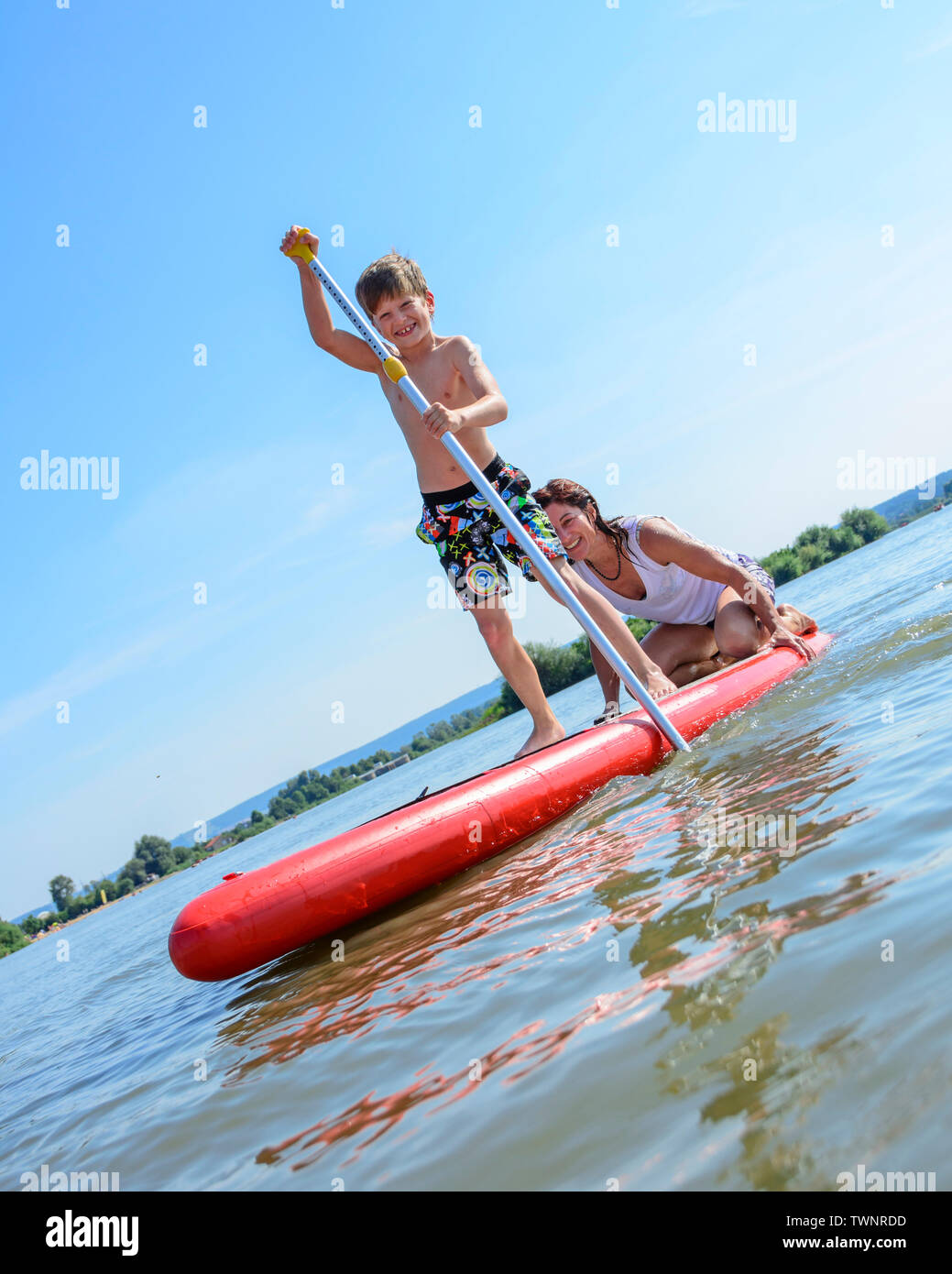 Funny times on SUP-board Stock Photo - Alamy