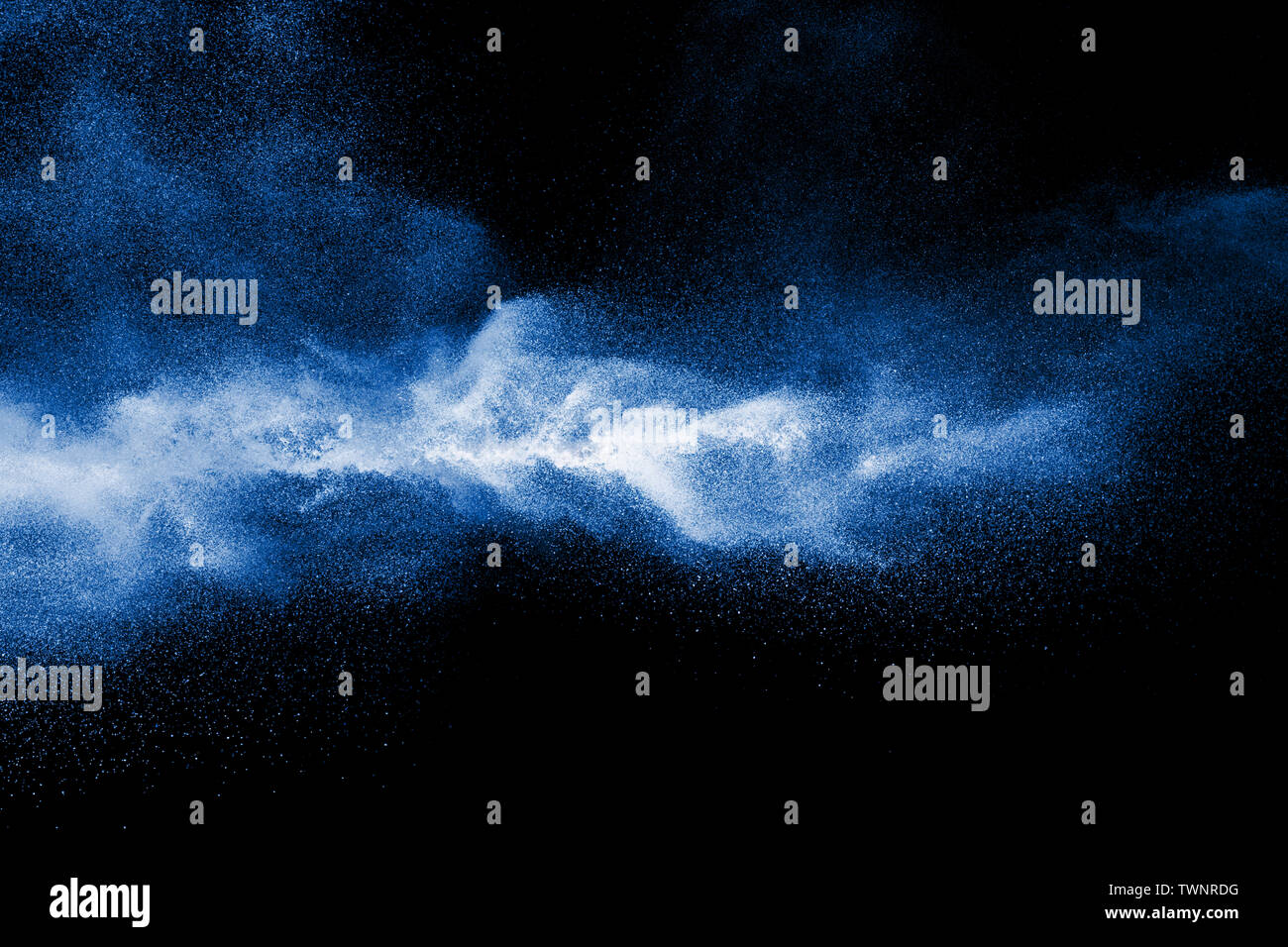 Splash of blue color powder dust on black background Stock Photo - Alamy