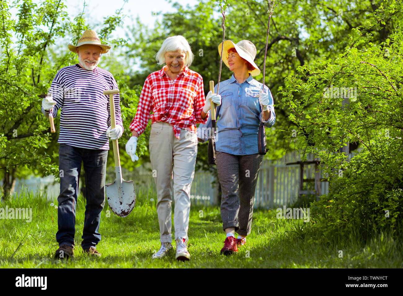 Ready for planting. Active and positive neighbors feeling excited and ...