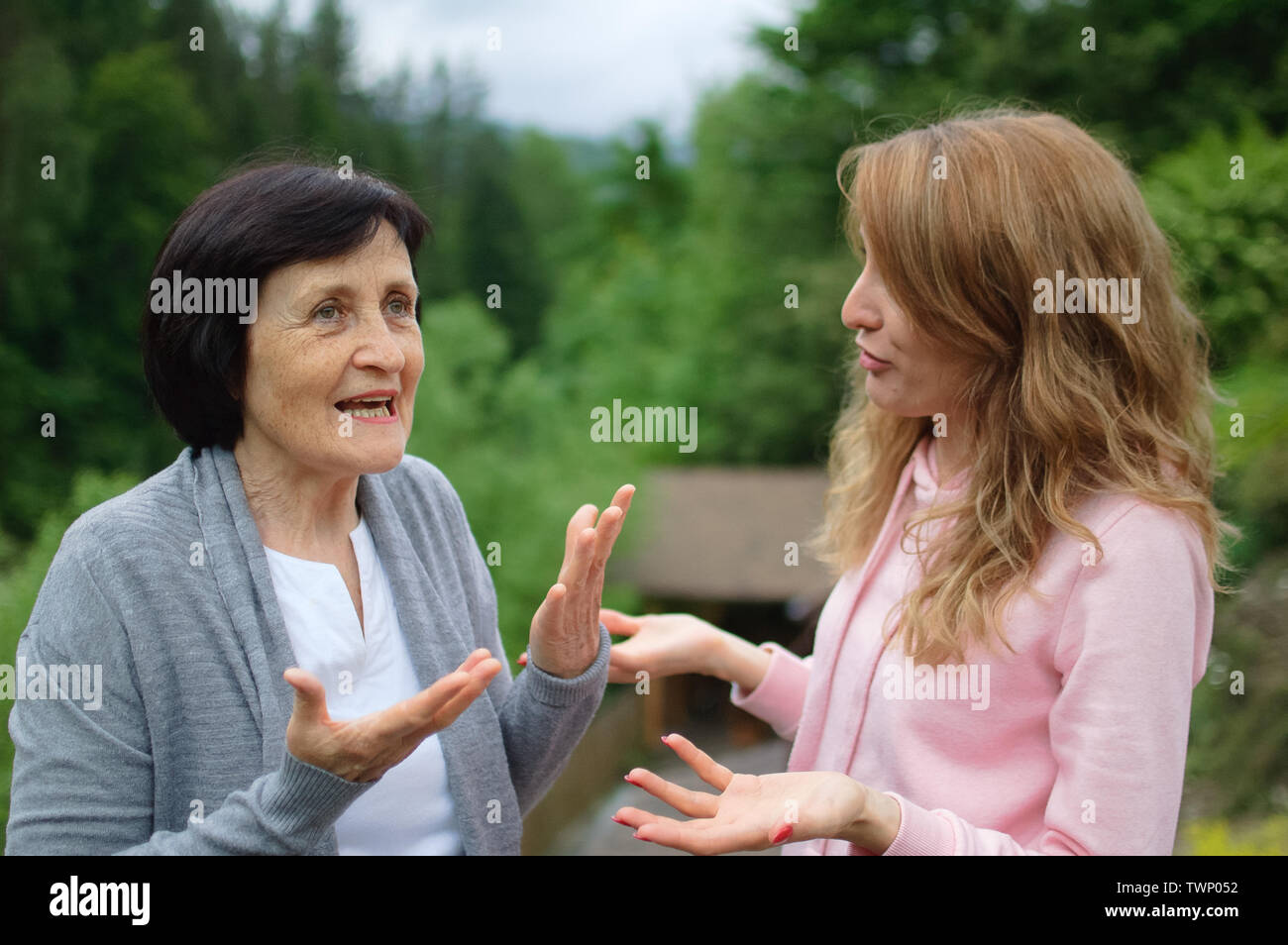 Beautiful women, two generations, mother and daughter are communicating ...