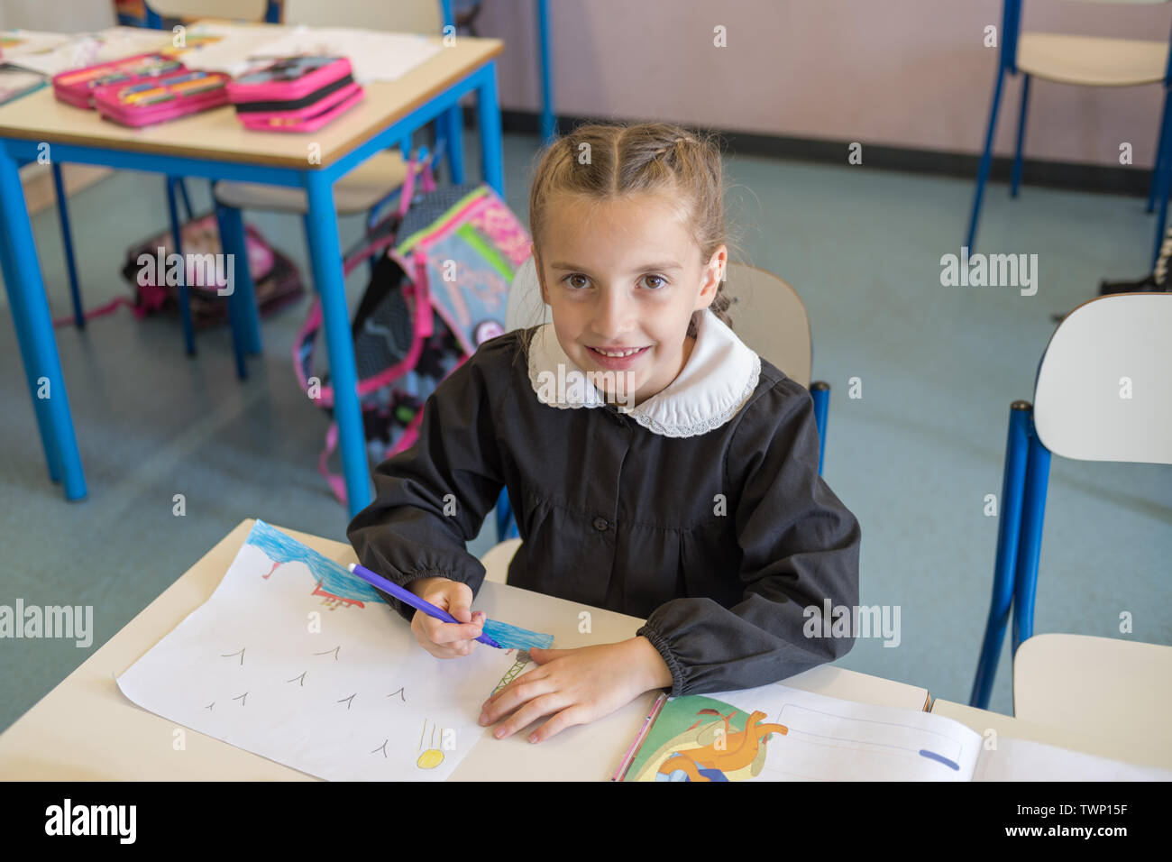 Elementary school student in classroom Stock Photo - Alamy